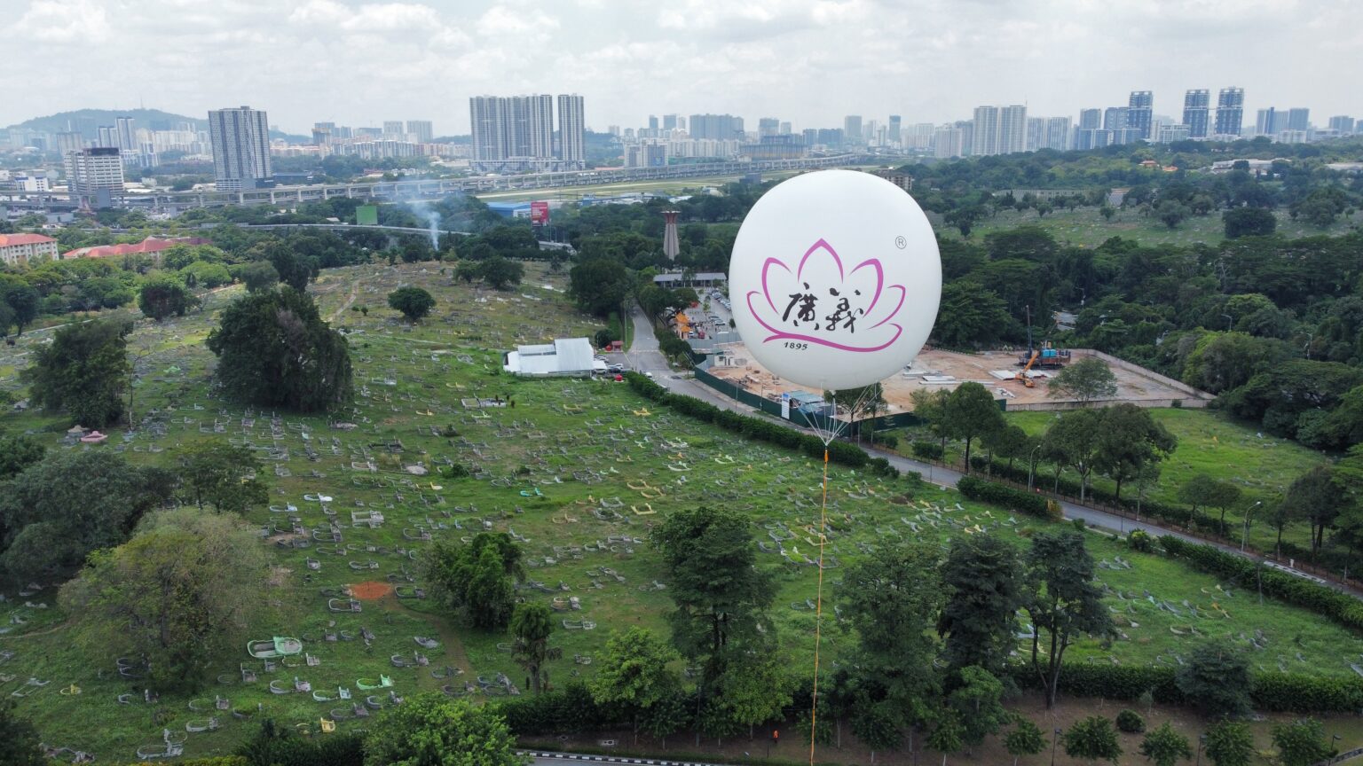 Giant Advertising Balloons rising high at Kwong Tong Cemetery ...